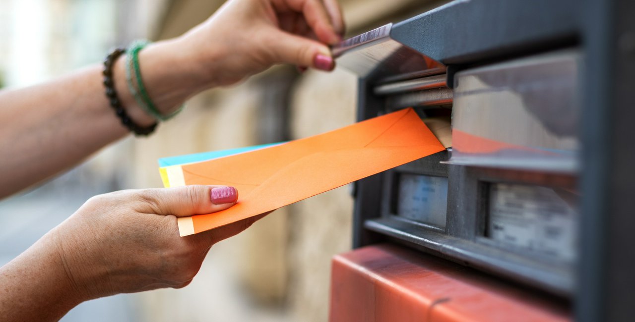 Person Mailing A Letter